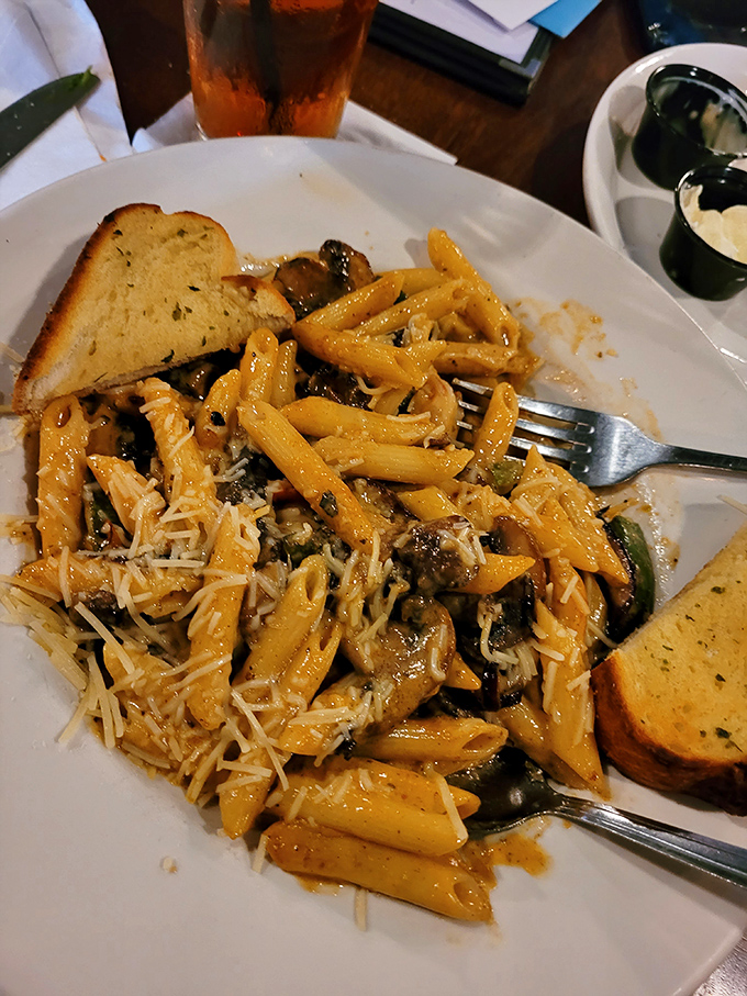 Pasta that doesn't just sit on the plate but tells a story, with each penne carrying sauce like little flavor messengers to your taste buds.