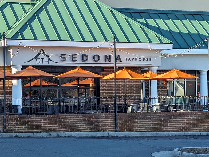 Sedona Taphouse's inviting patio, with its cheerful orange umbrellas, beckons you to settle in for craft beers and conversation as the afternoon gently unfolds.