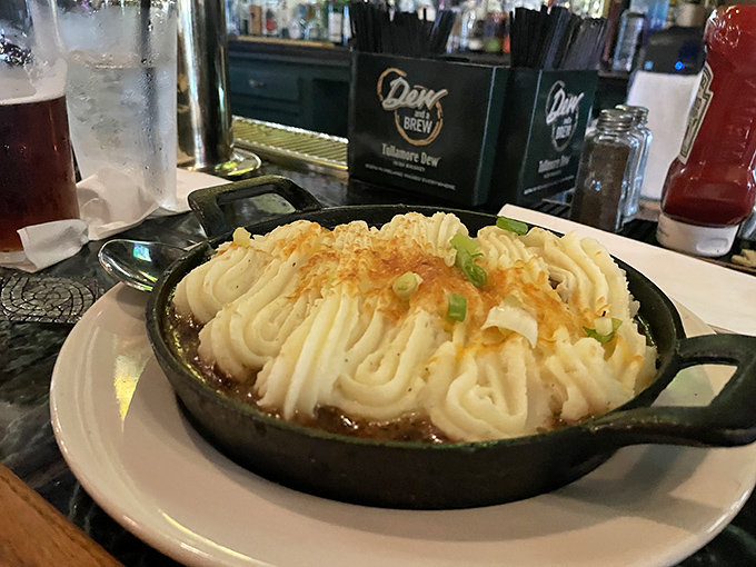 Shepherd's pie reimagined with a piped mashed potato roof so perfectly browned you'll want to take out a mortgage and move in.