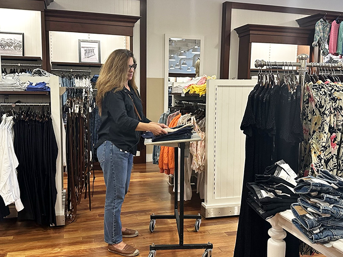 The thrill of the hunt is written all over this shopper's face as she discovers her next fashion treasure. Retail therapy at its finest.