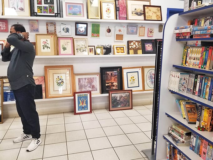 The art section offers everything from kitschy to classy. One shopper contemplates whether that framed butterfly might be the perfect addition to their gallery wall.