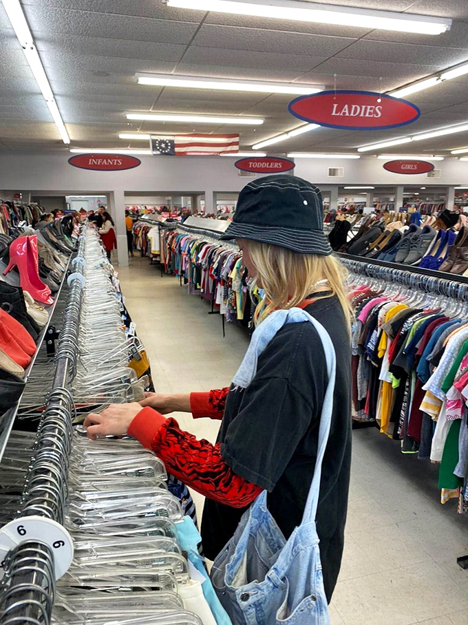 A shopper navigates the carefully organized racks, hunting for that perfect piece&mdash;thrifting is part skill, part meditation, all adventure.