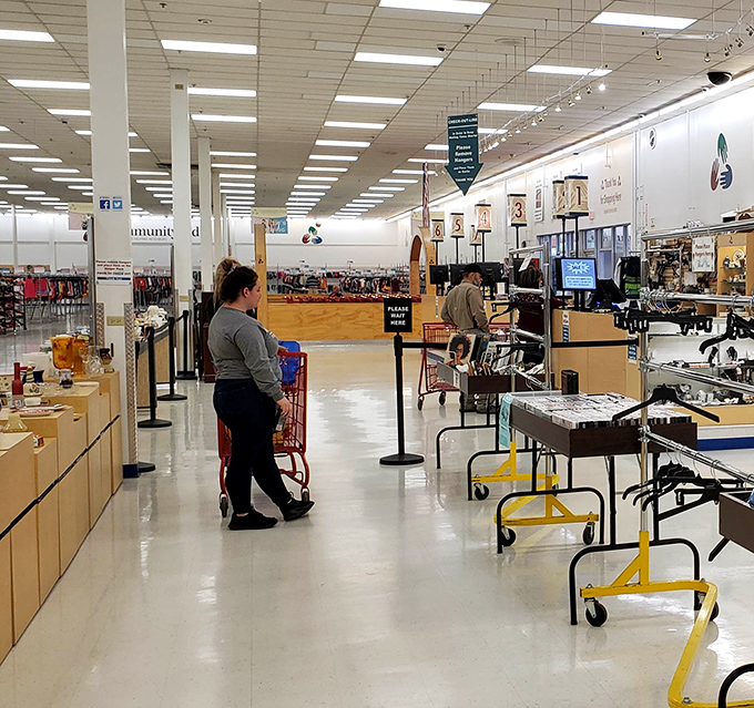 The thrill of the hunt in action as shoppers navigate the well-organized aisles, each rack a potential goldmine of fashion finds.