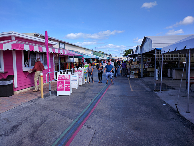 The weekend crowd navigates the market's arteries, where every turn promises new discoveries and unexpected finds.