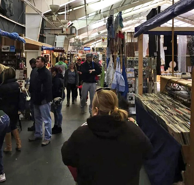 The indoor aisles buzz with weekend warriors on the hunt. Where strangers become temporary allies in the quest for hidden gems.