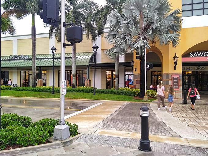 Even in the rain, Calvin Klein beckons with minimalist displays that whisper, "Yes, you can afford me today."