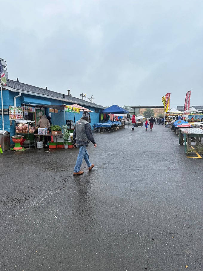 Even on drizzly days, the market's spirit remains undampened—dedicated shoppers navigate the puddles knowing treasures don't mind a little rain.