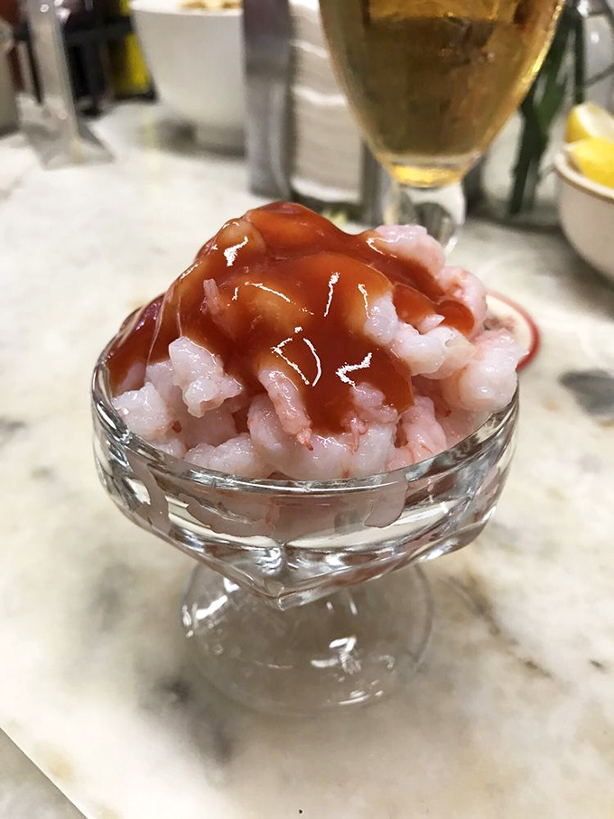 Bay shrimp cocktail &ndash; tiny pink jewels of the sea, swimming in just enough cocktail sauce to complement, not overwhelm. Simplicity that speaks volumes.