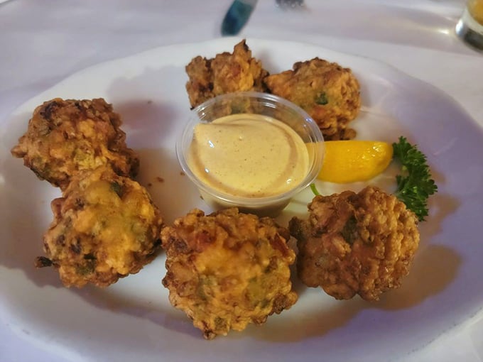 These golden fritters aren't just appetizers&mdash;they're little flavor grenades waiting to explode with shrimpy goodness and that dipping sauce seals the deal.