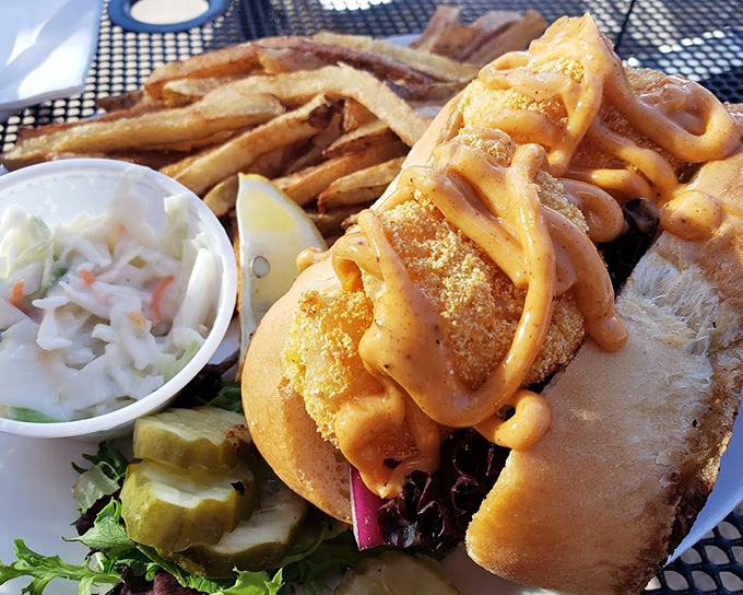 This po' boy isn't poor in flavor &ndash; golden fried shrimp drizzled with spicy sauce creates a sandwich worth crossing state lines for.