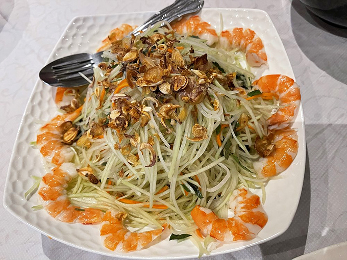 This shrimp papaya salad is the perfect palate refresher&mdash;crisp, vibrant, and arranged with the precision of a small edible art installation.