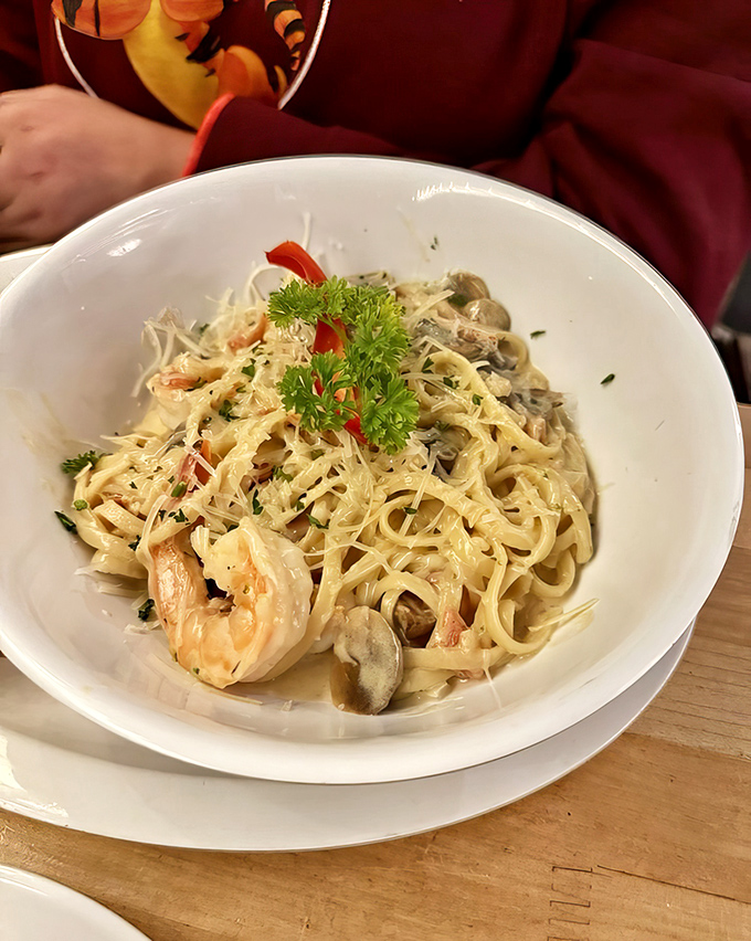Pasta that doesn't just have seafood in it, but seems to celebrate it &ndash; shrimp and clams dancing through creamy strands like they're having their own little party.