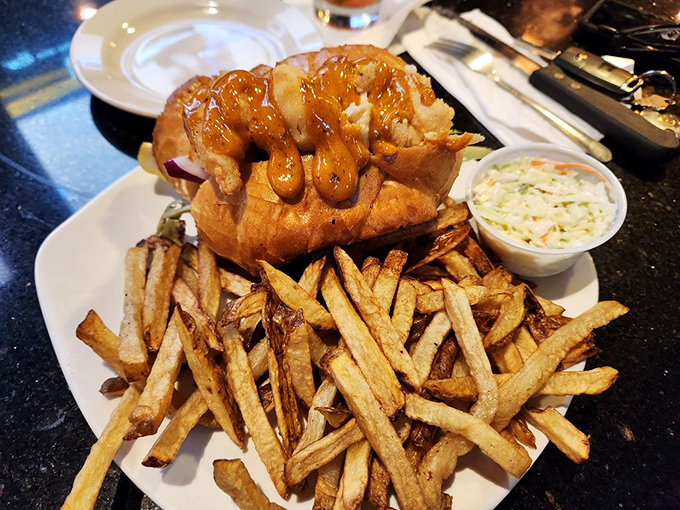 This isn't just a sandwich; it's an architectural masterpiece of golden-fried shrimp and crispy fries that demands respect.