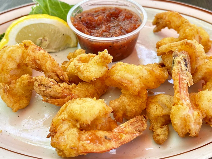 Fried shrimp so perfectly golden, they deserve their own trophy. That light, crispy batter is what other seafood shacks dream about at night.
