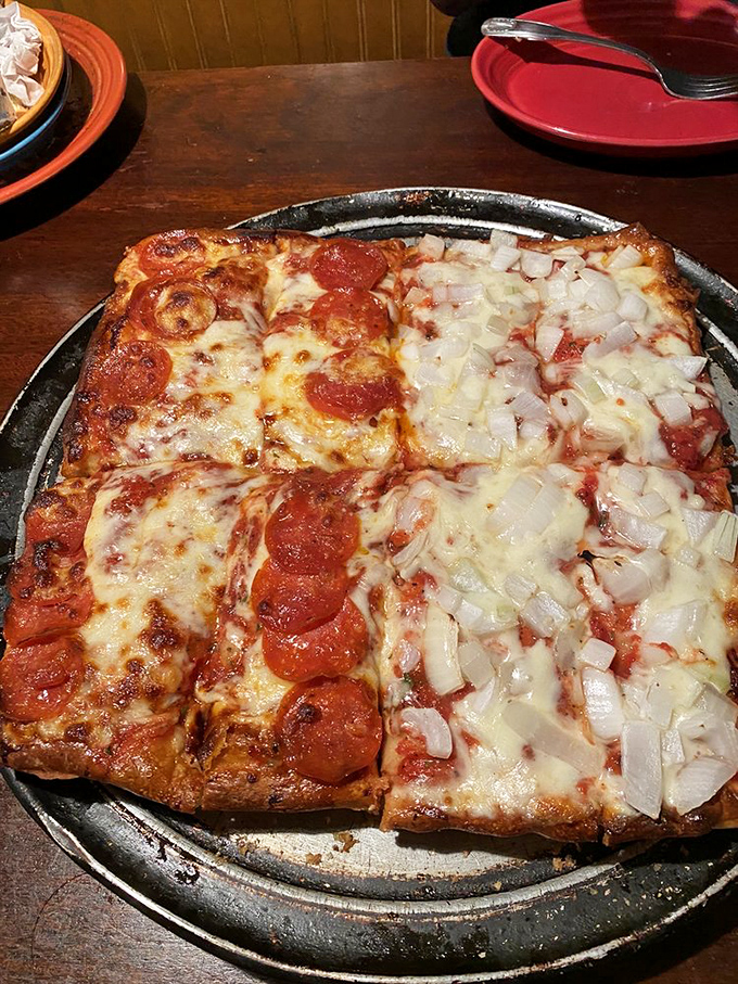 The legendary Sicilian pizza in all its glory. Half pepperoni, half onion, all magnificent on that perfectly risen square crust.