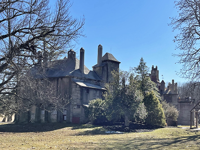 The castle's rear view showcases its organic growth pattern, as if the building sprouted naturally from Pennsylvania soil rather than being deliberately constructed.