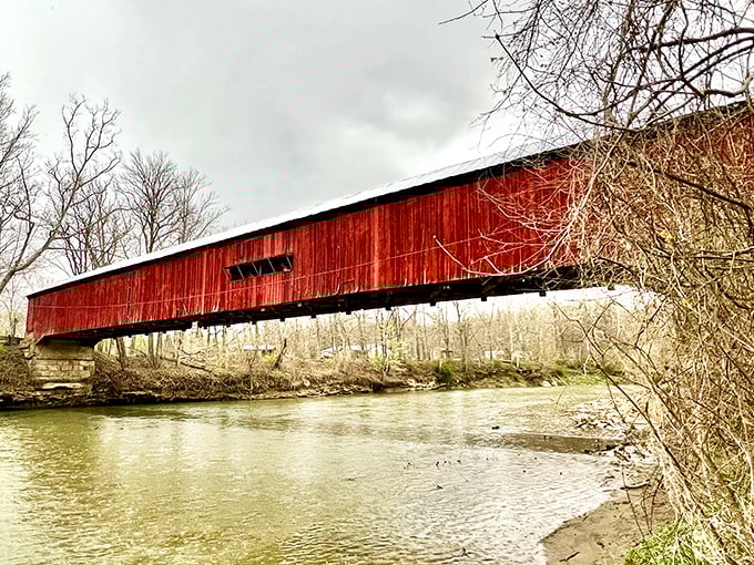 The bridge's striking silhouette against moody skies proves even cloudy days can't dampen its rustic charm. Some landmarks just refuse to be upstaged.