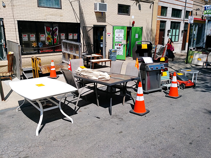 The sidewalk sale&mdash;where furniture finds fresh air before finding new homes. Those traffic cones seem to be directing shoppers to the best deals.