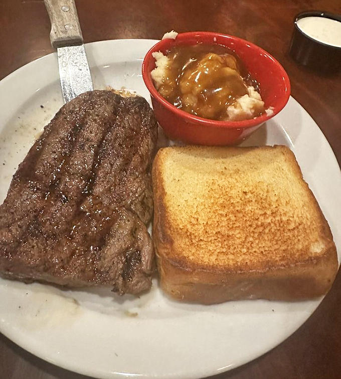 A perfectly grilled steak, a side of mashed potatoes with gravy, and Texas toast&mdash;the holy trinity of comfort food that never goes out of style.