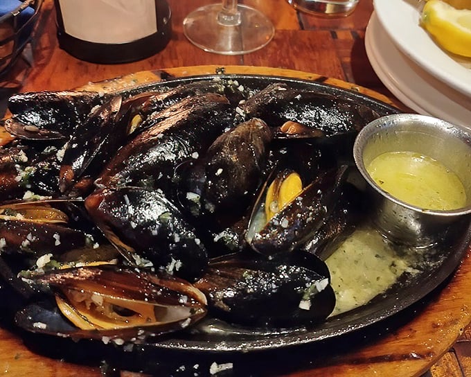 These mussels aren't just sizzling—they're performing a delicious cabaret on your plate, with butter and garlic providing the soundtrack.