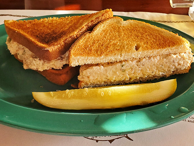 The fish spread sandwich: where yesterday's catch becomes today's treasure, nestled between perfectly toasted bread with a lemon wedge standing guard.