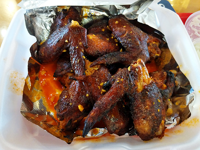 These wings achieved flight status through smoke alone, glistening with sauce that whispers sweet barbecue nothings.