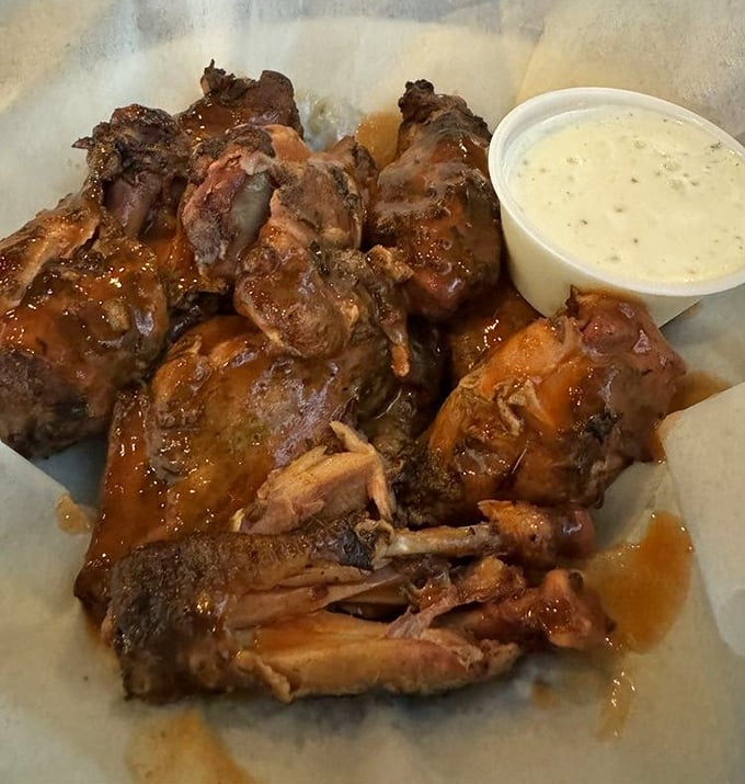 These wings aren't just saucy, they're downright scandalous &ndash; glistening with BBQ glaze and practically falling off the bone in slow motion.