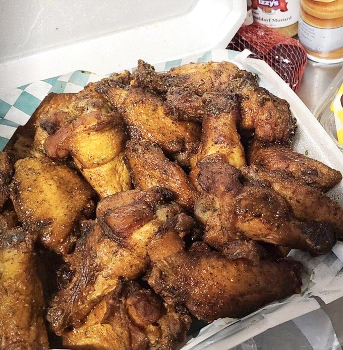 These wings have lived two glorious lives &ndash; first kissed by smoke, then transformed by fire into crispy, seasoned perfection that would make angels weep.