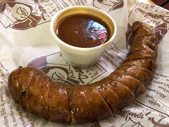 The humble sausage, elevated to art form. That smoke ring isn't just for show&mdash;it's the barbecue equivalent of a Michelin star.