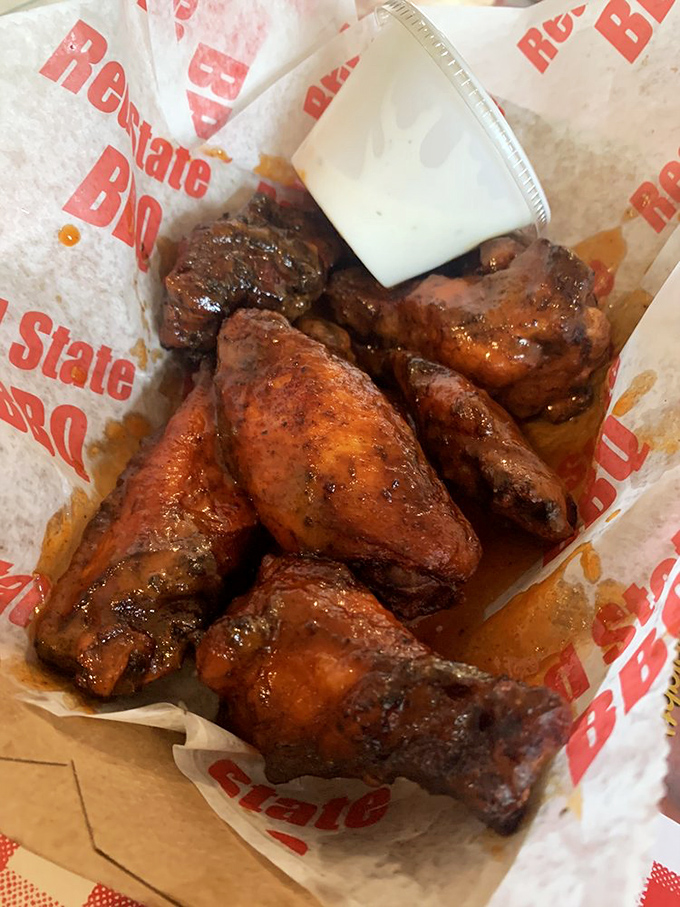Wings that make you question why we ever bothered inventing forks. These smoky beauties demand to be picked up and savored down to the last sticky fingertip.