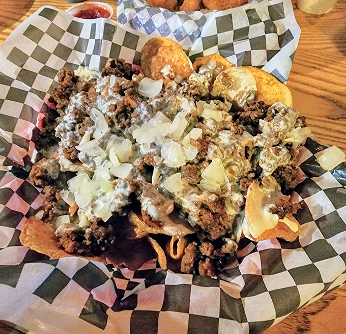 Loaded nachos that require a strategy to eat—like a delicious game of Jenga where everyone wins, especially your taste buds.