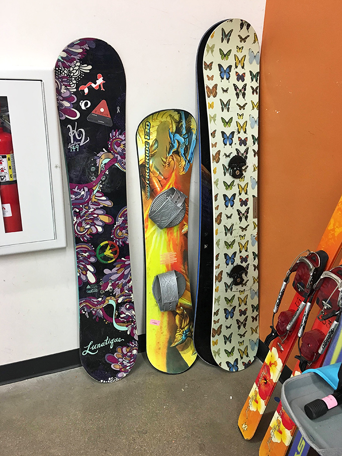 Snowboards waiting for their next powder day. That butterfly-themed board might just be the conversation starter your winter needs.