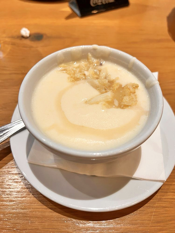 A bowl of creamy seafood soup that whispers, "Cancel your plans for the afternoon; this moment deserves your full attention."