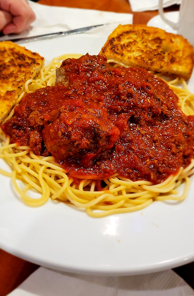 Spaghetti and meatballs with garlic toast&mdash;the kind of honest, unpretentious plate that reminds you why some classics never need reinvention, just proper respect.