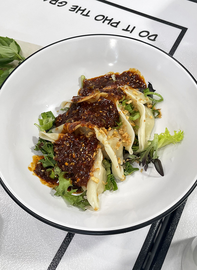 These dumplings aren't just sitting on lettuce&mdash;they're making a fashion statement. Spicy, savory, and dressed to impress.