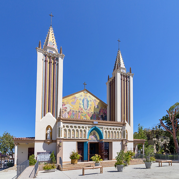St. Anthony Catholic Church stands as a spiritual sentinel with twin spires reaching skyward, its colorful fa&ccedil;ade telling stories in sunshine and shadow.