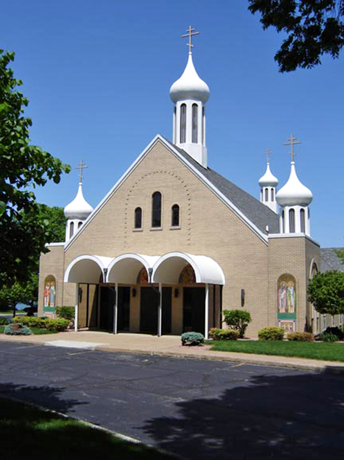 St. Mary's distinctive onion domes bring unexpected Eastern European flair to this Ohio lakeside town, standing out against the clear blue sky.