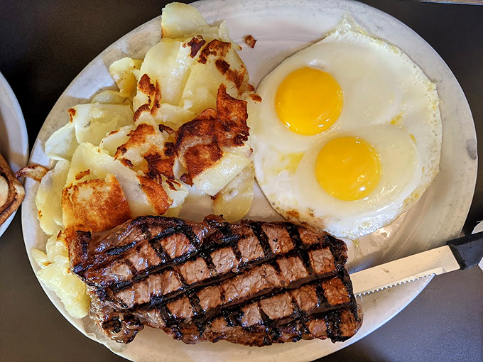The Virginian's steak and eggs: where breakfast meets dinner and nobody questions your life choices. Those hash browns have achieved the perfect golden ratio.