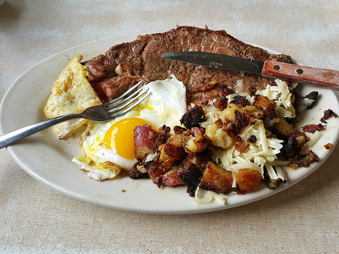 This isn't just steak and eggs&mdash;it's morning's perfect power couple. That sunny-side up egg winks at you like it knows something you don't.