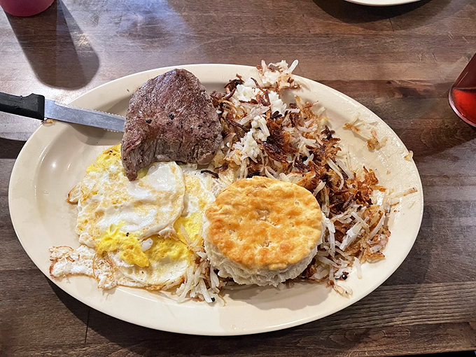Steak and eggs&mdash;the breakfast of champions who plan on going back to bed afterward. That biscuit isn't just a side; it's an event.
