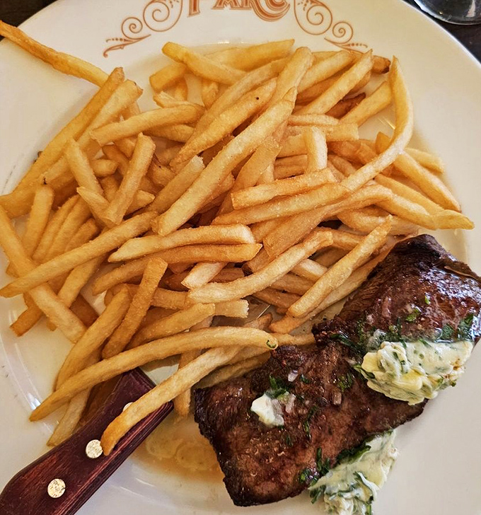 The steak frites arrives like a French declaration of independence from boring meals&mdash;crispy fries stacked high beside a perfectly seared New York strip.