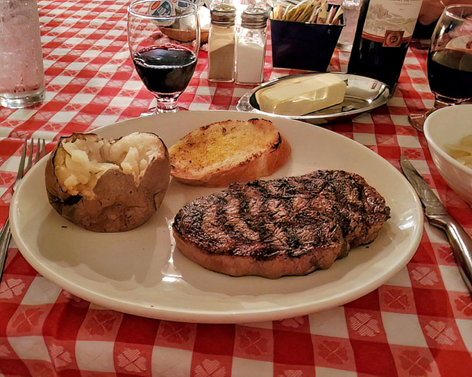 When your steak arrives with a glass of red wine, it's not just dinner&mdash;it's a ceremony. This plate deserves a moment of silent appreciation before the first cut. 