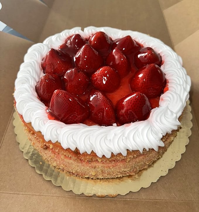 Strawberry cheesecake that makes you want to write poetry. Those glistening berries are nature's jewelry atop a creamy masterpiece.