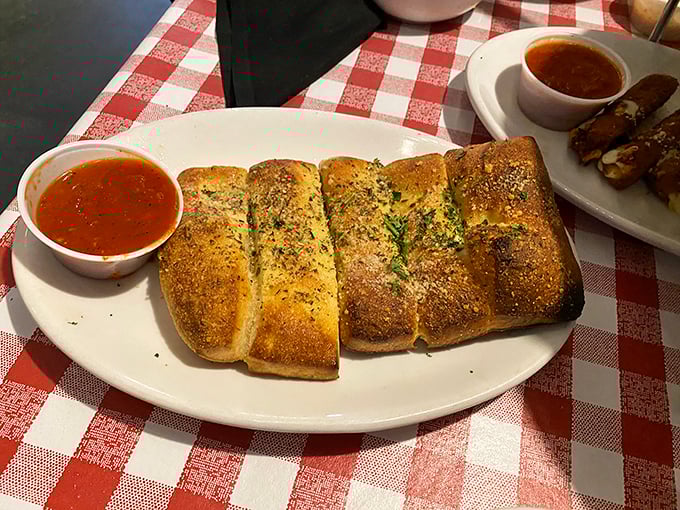 Golden-brown stromboli that's been kissed by the oven gods, served with marinara that demands to be dunked into.