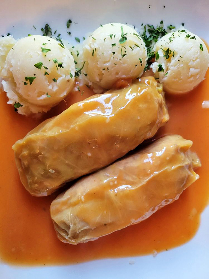 These golabki swim in tomato sauce like little cabbage-wrapped presents, delivering comfort with every tender, savory bite you take.