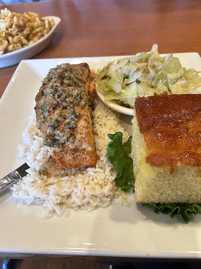 The herb-crusted salmon doesn't just sit on the rice&mdash;it presides over it like royalty, with cabbage and cornbread as loyal subjects.