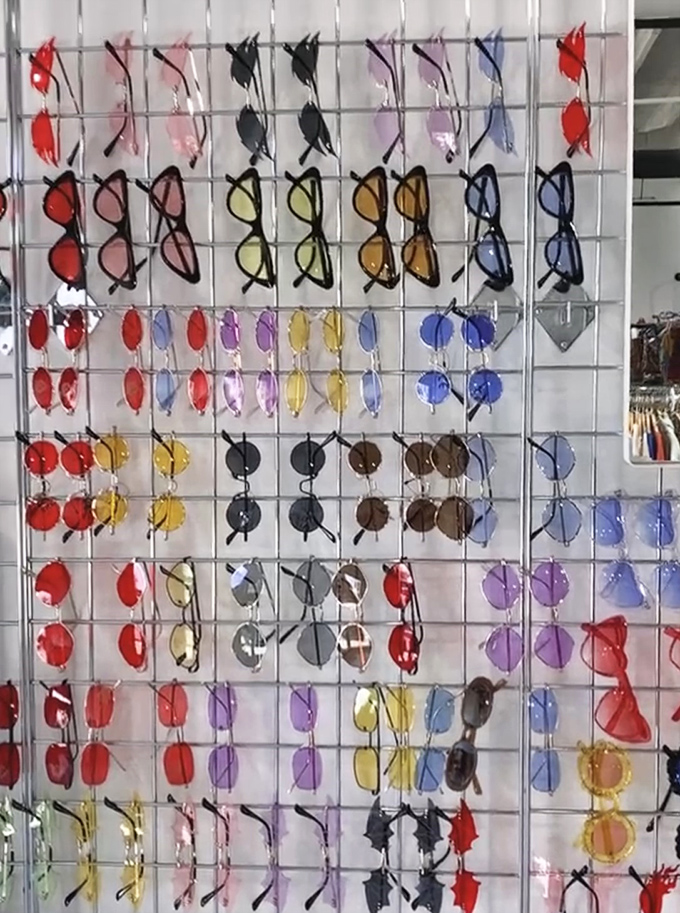 A rainbow of sunglasses organized by color because even your eyewear deserves to make a statement without breaking the bank.