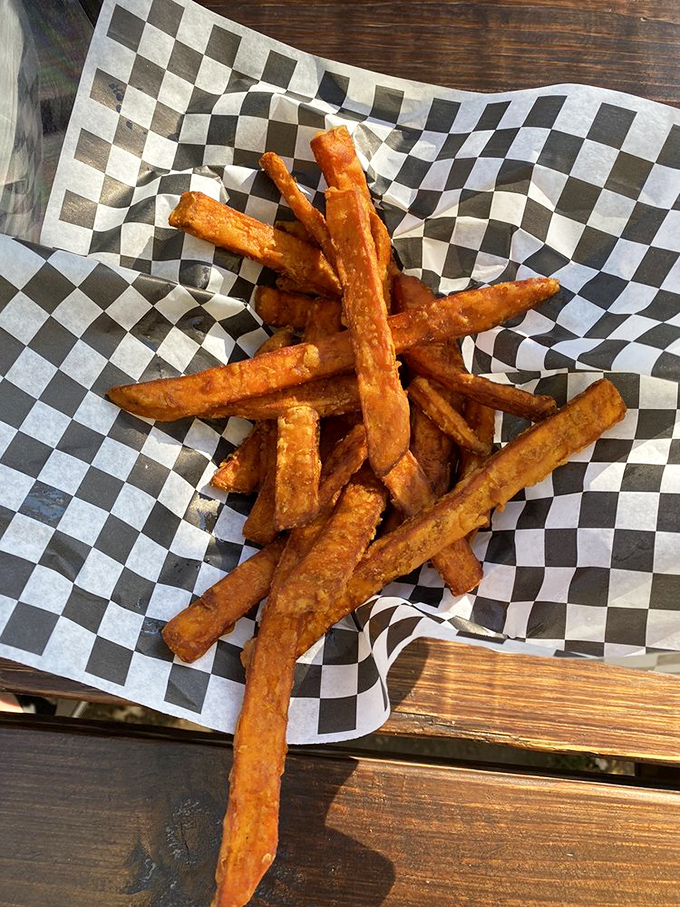 Sweet potato fries that achieve the impossible trifecta: crispy exterior, tender interior, and seasoning that makes you forget regular fries exist.