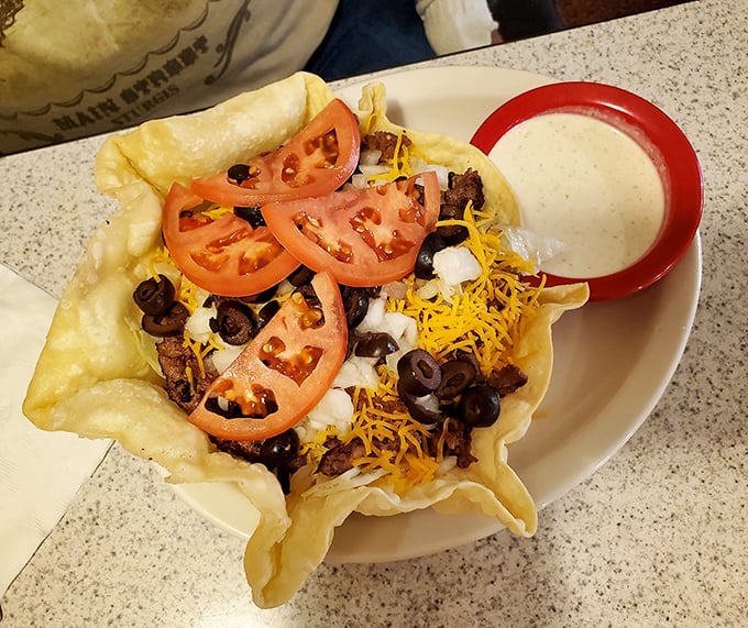 This taco salad bowl isn't just food&mdash;it's architecture. The crispy shell cradles a mountain of ingredients with a side of ranch that's practically begging for a dip.
