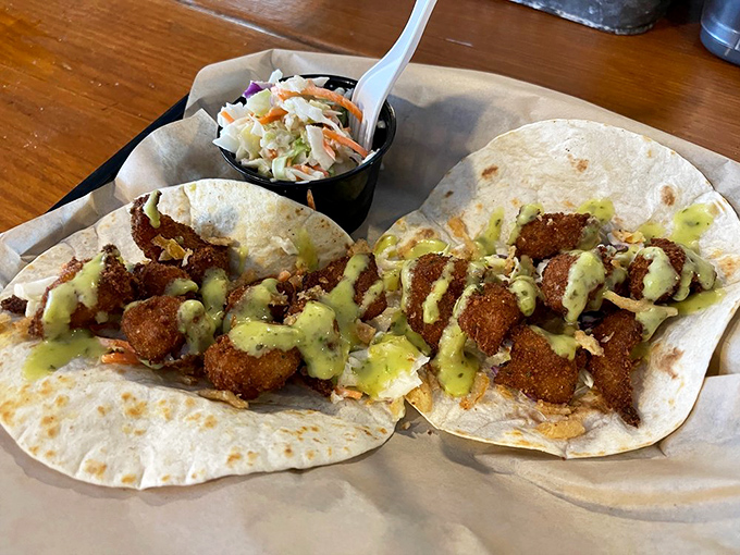 These seafood tacos aren't trying to be trendy; they're just being delicious. The sauce drizzled on top is the kind of finishing touch that makes you slow down and savor.